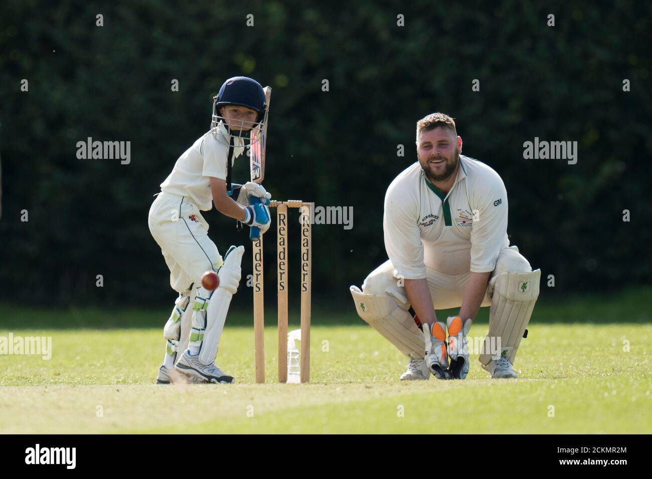 Young boy playing cricket shot during village cricket match for all ...
