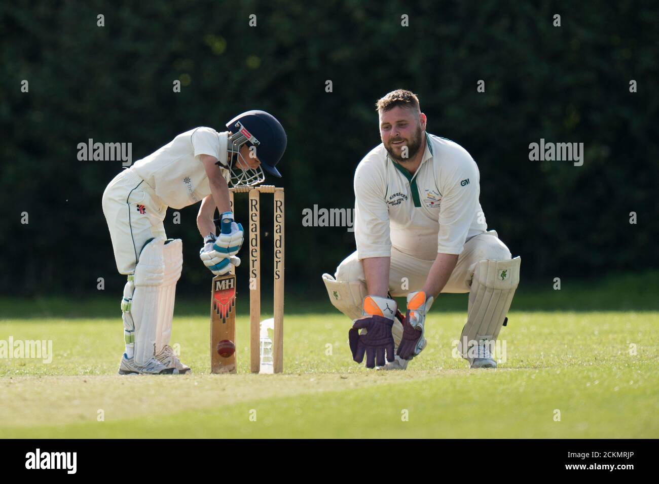 Young boy playing cricket shot during village cricket match for all ...
