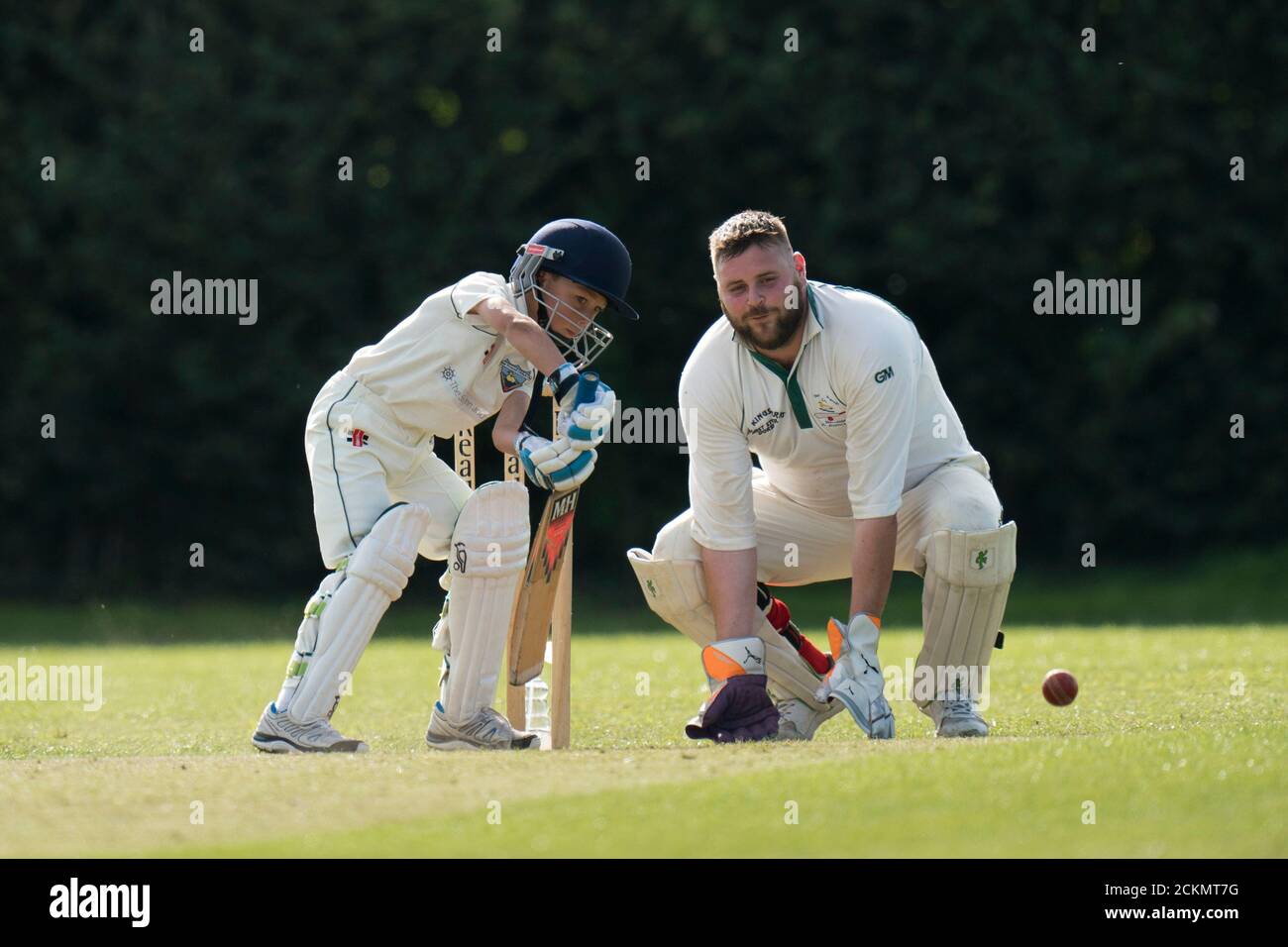 Young boy playing cricket shot during village cricket match for all ...
