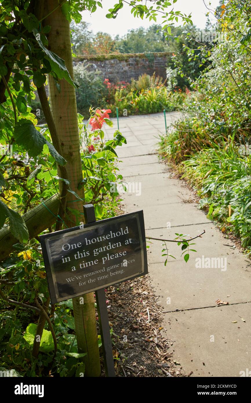 Covid 19 warning sign showing restrictions in a Country Garden, UK, GB ...
