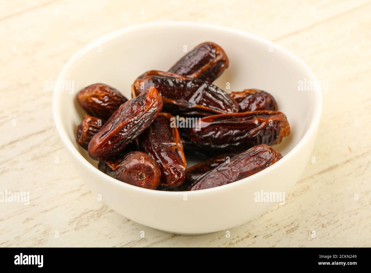 Sweet dates fruit heap in the bowl Stock Photo - Alamy