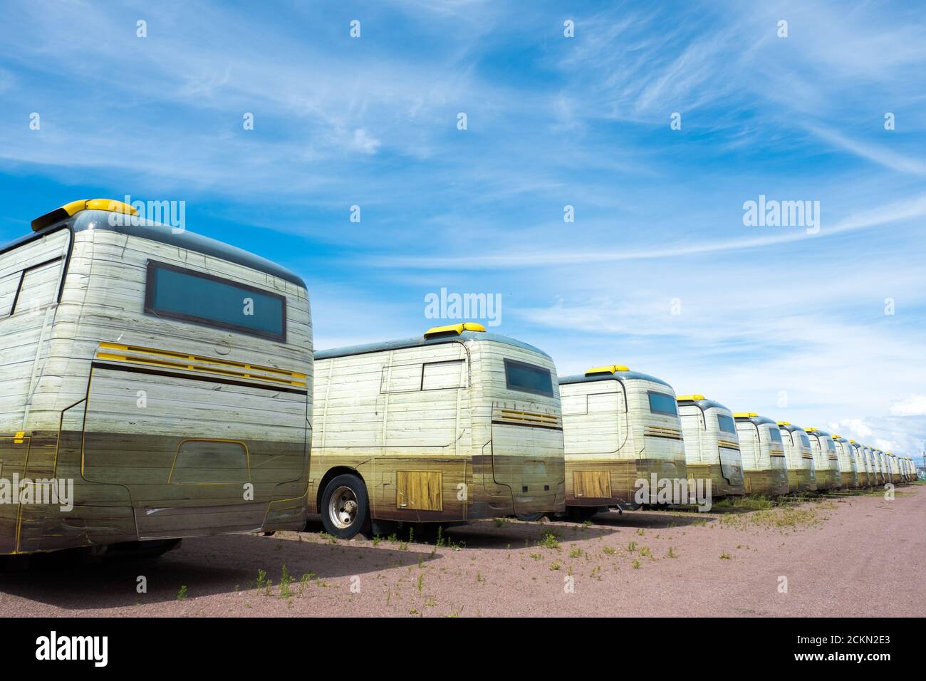Row of camper vans in sunny weather. A roadside motel of caravans ...