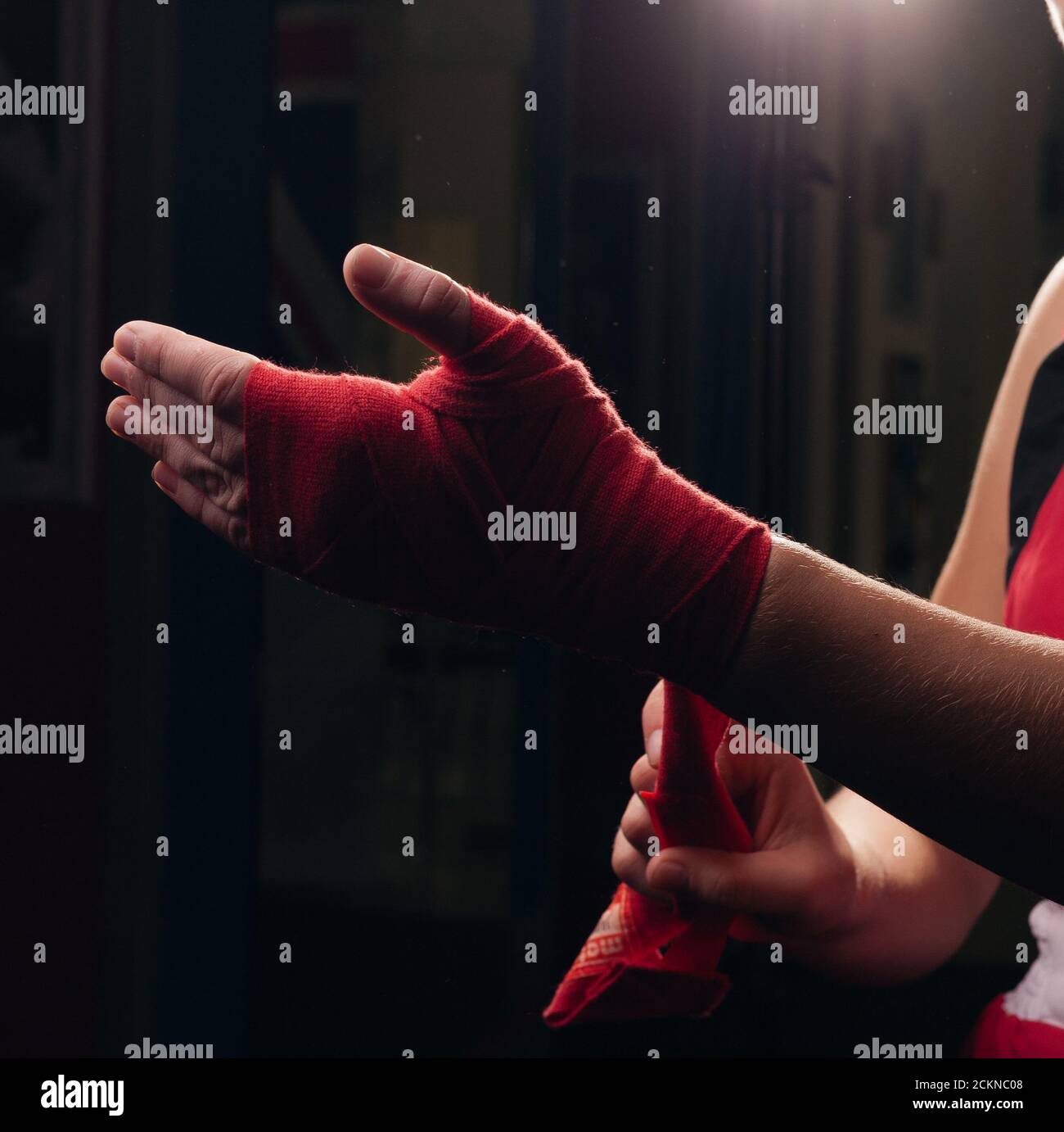 Boxer girl in red boxing bands close-up Stock Photo - Alamy