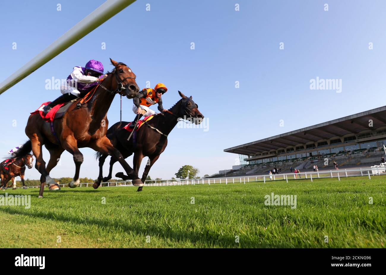 Delicate Kiss ridden by jockey George Rooke (right) wins the Hampton ...