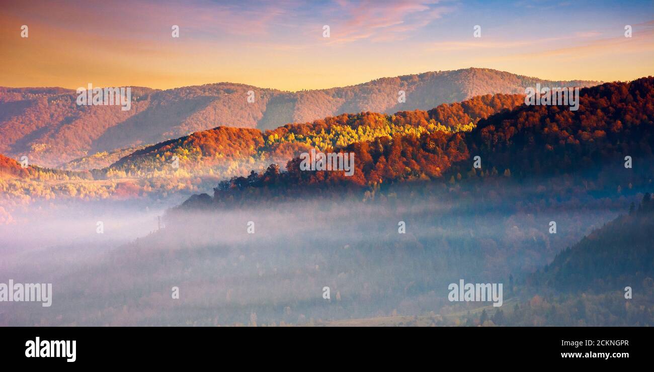 mountain landscape in autumn. fog glowing in morning light. dramatic ...