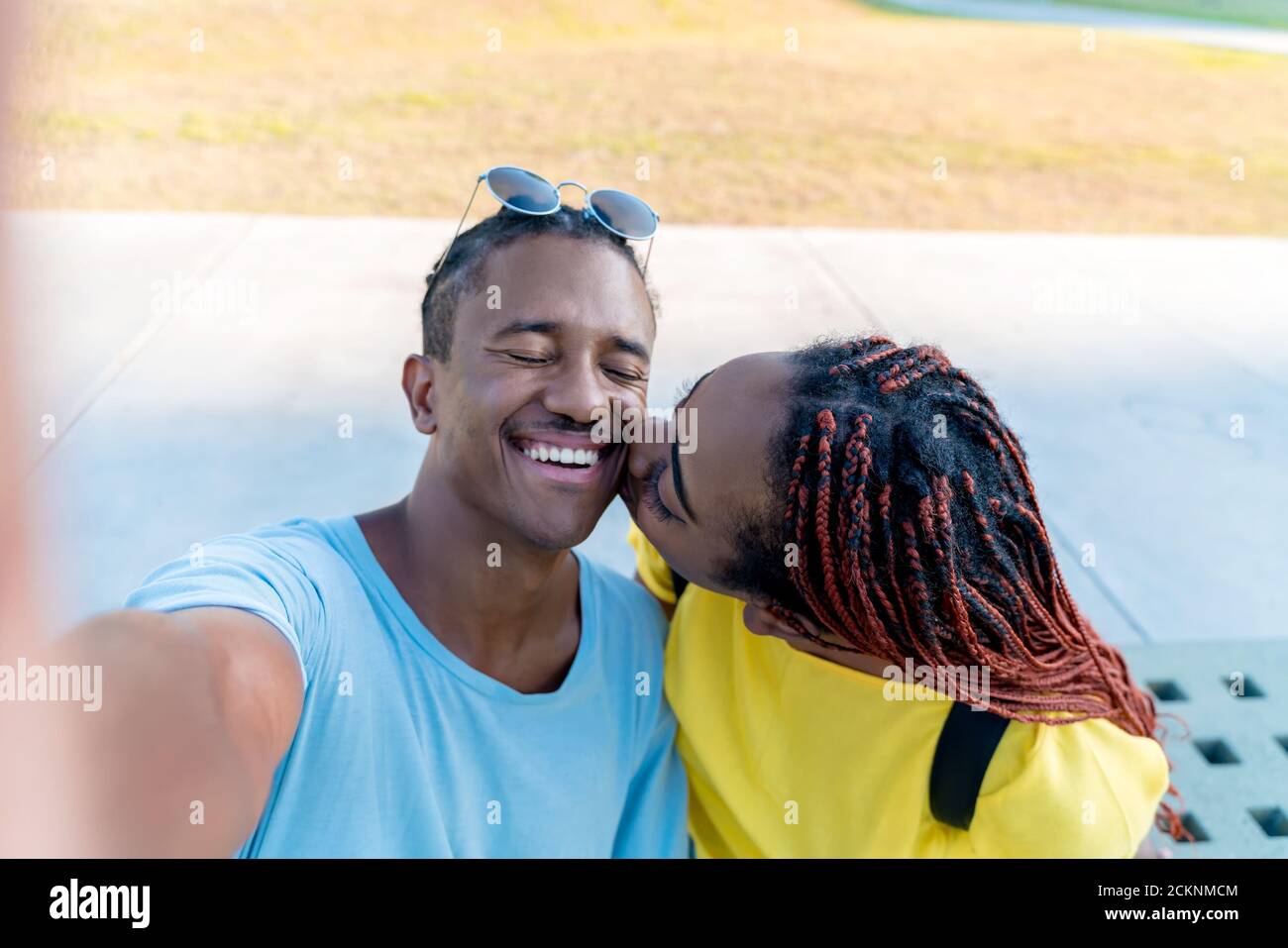 Selfie of a kissing young black couple on a sunny summer day Stock ...