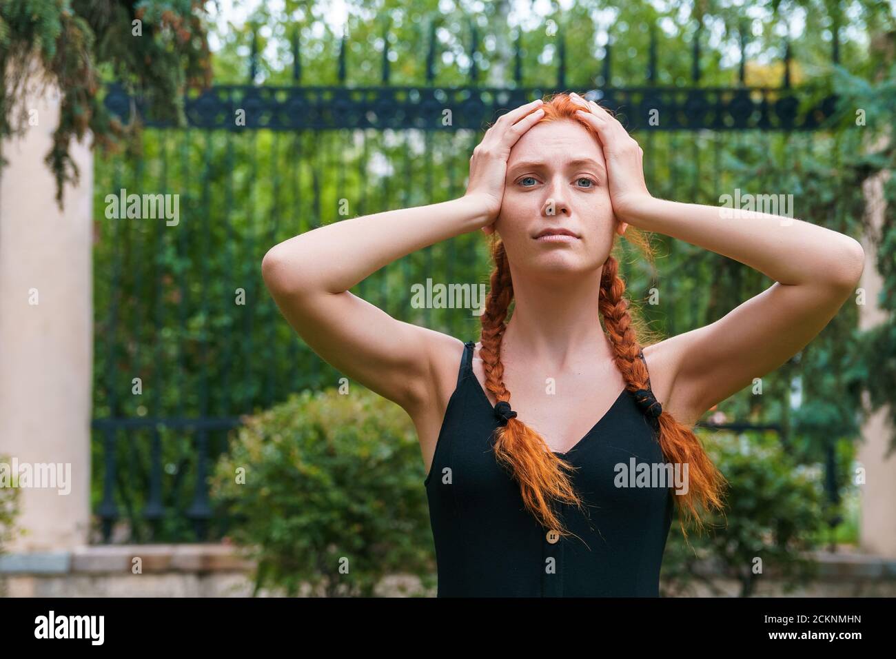 Beautiful restless girl holding her head. Turmoil and fuss concept with ...