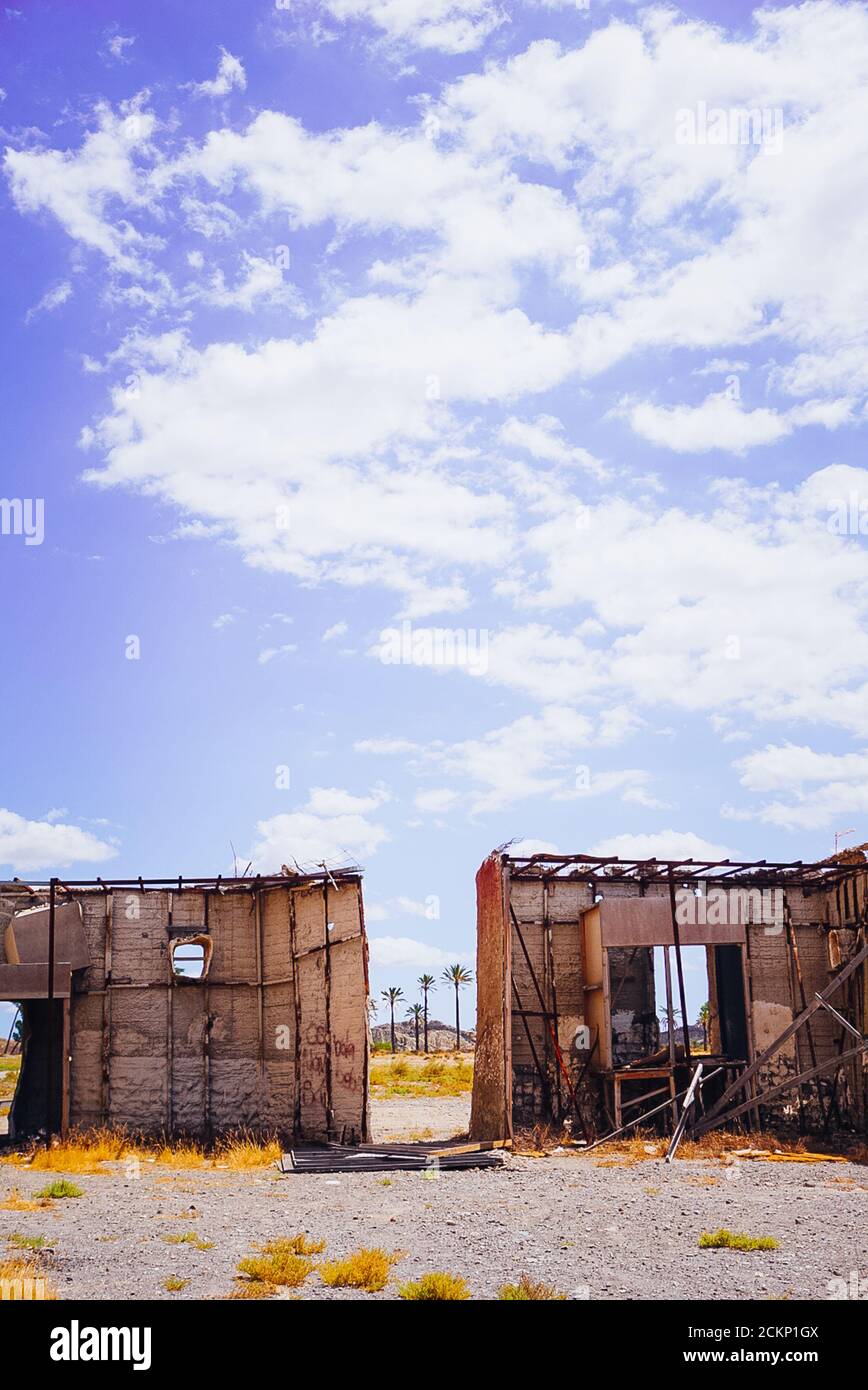 Vertical shot of an abandoned rural area in a dry field during daylight ...