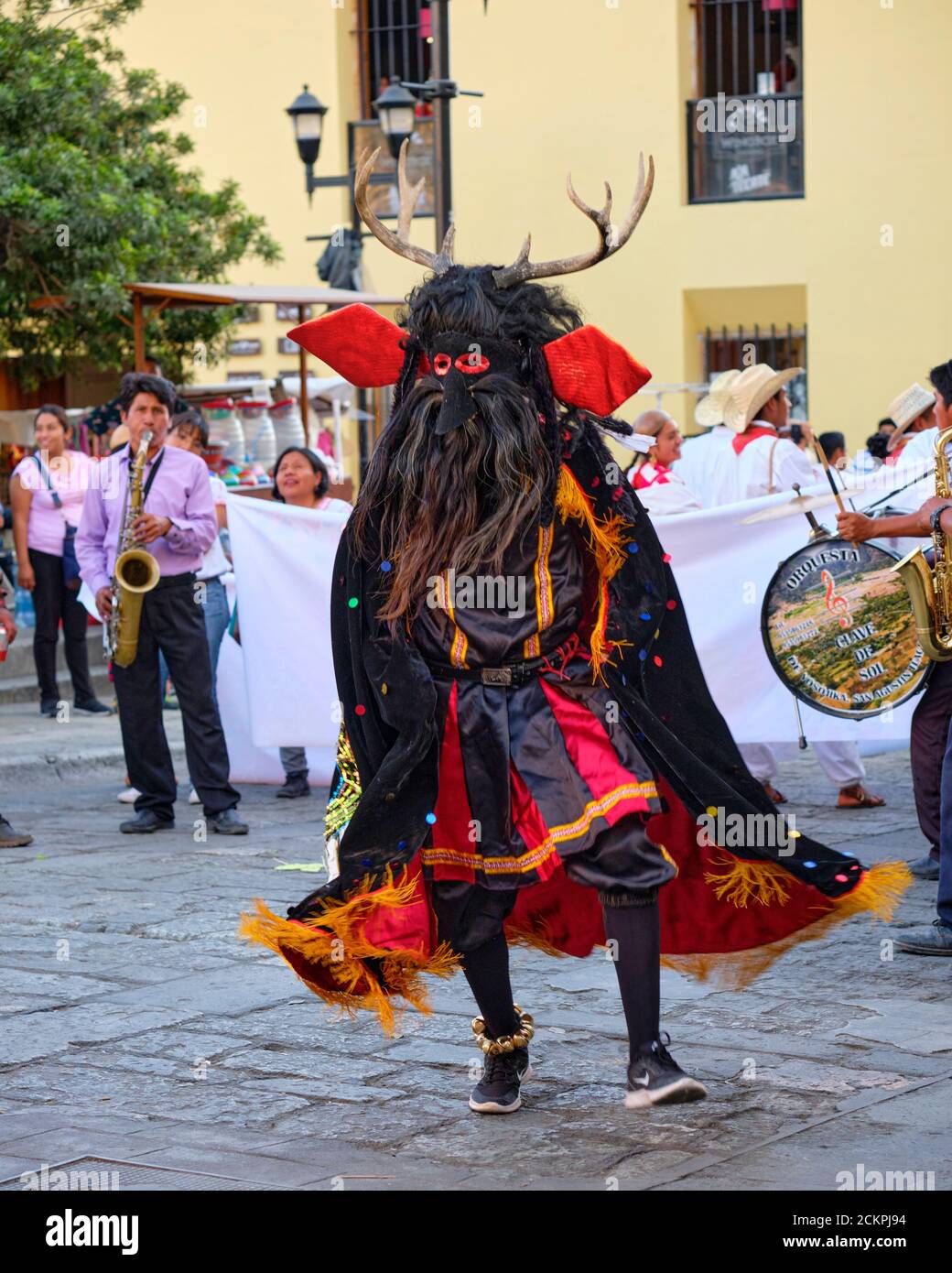 Mexican Devil creature with antlers walking and dancing in a parade in ...