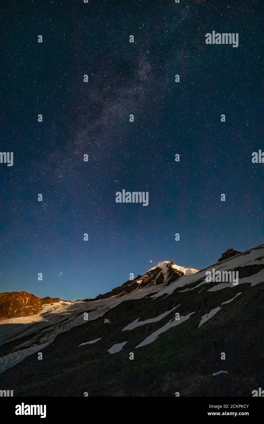 Mount Baker at night, lit up by the moon, with stars all around, Mount ...