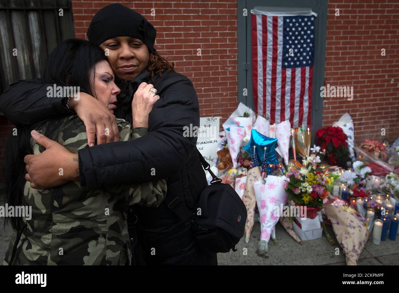Two police officers hug in hi-res stock photography and images - Alamy