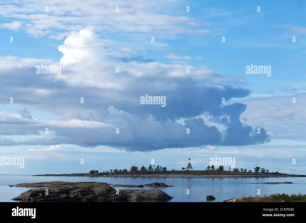 Sea, ocean and a navigation mark in the archipelago. Clouds and calm ...