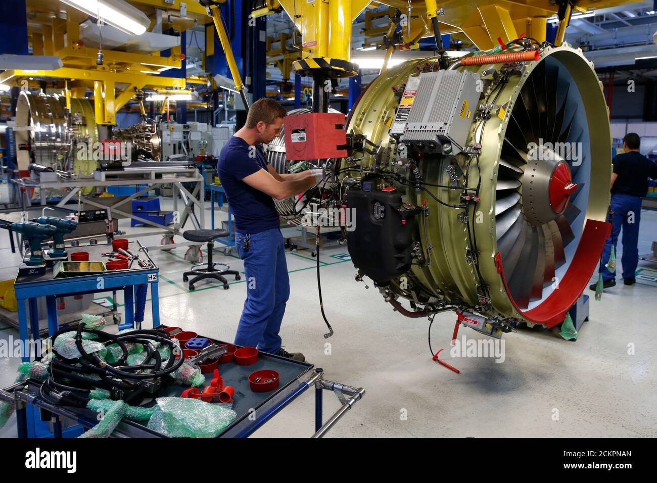 Technicians work on an CFM56 civil aviation jet engine at the SNECMA ...