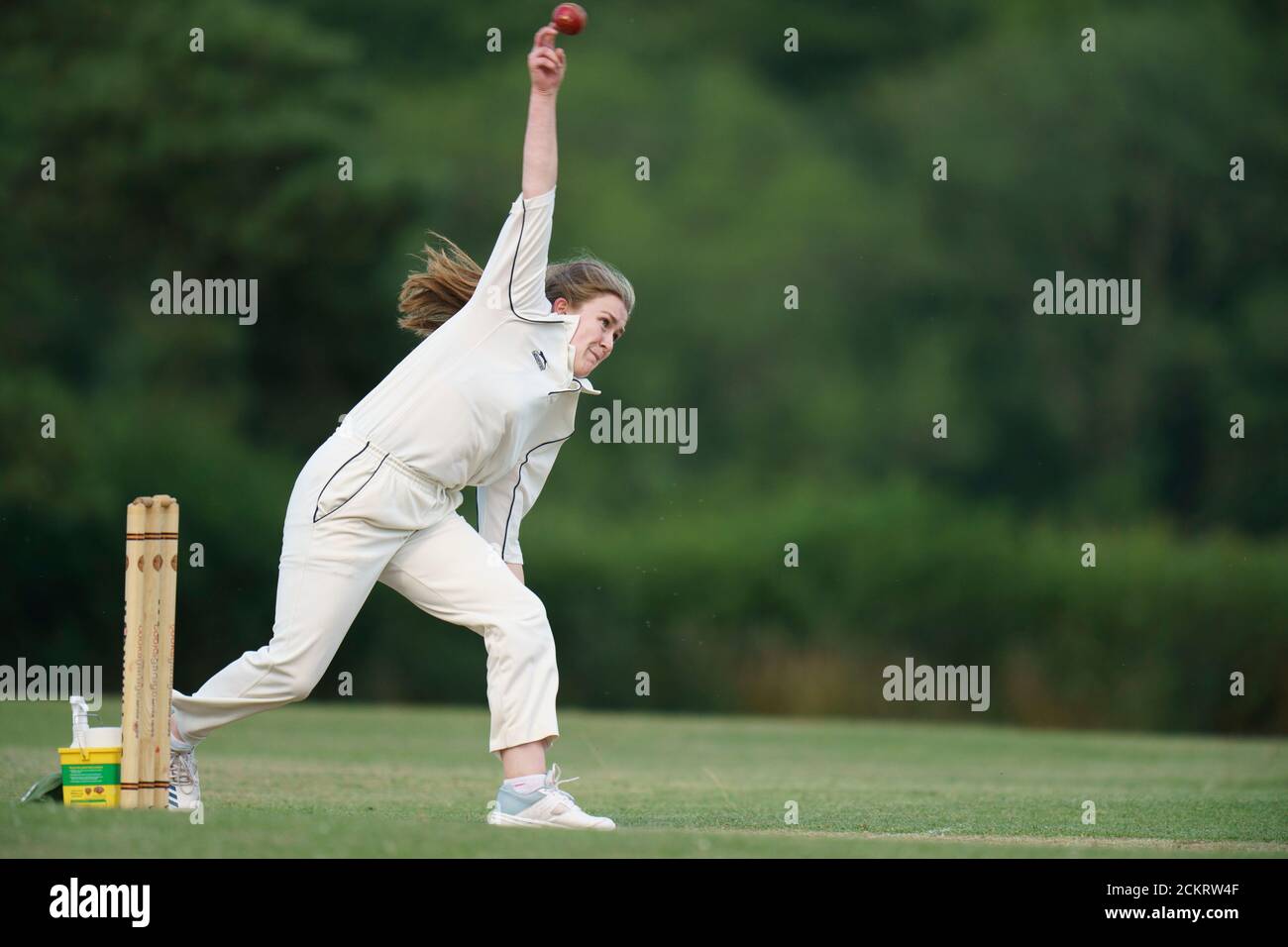 Female cricket player bowling, Dorset, England Stock Photo - Alamy