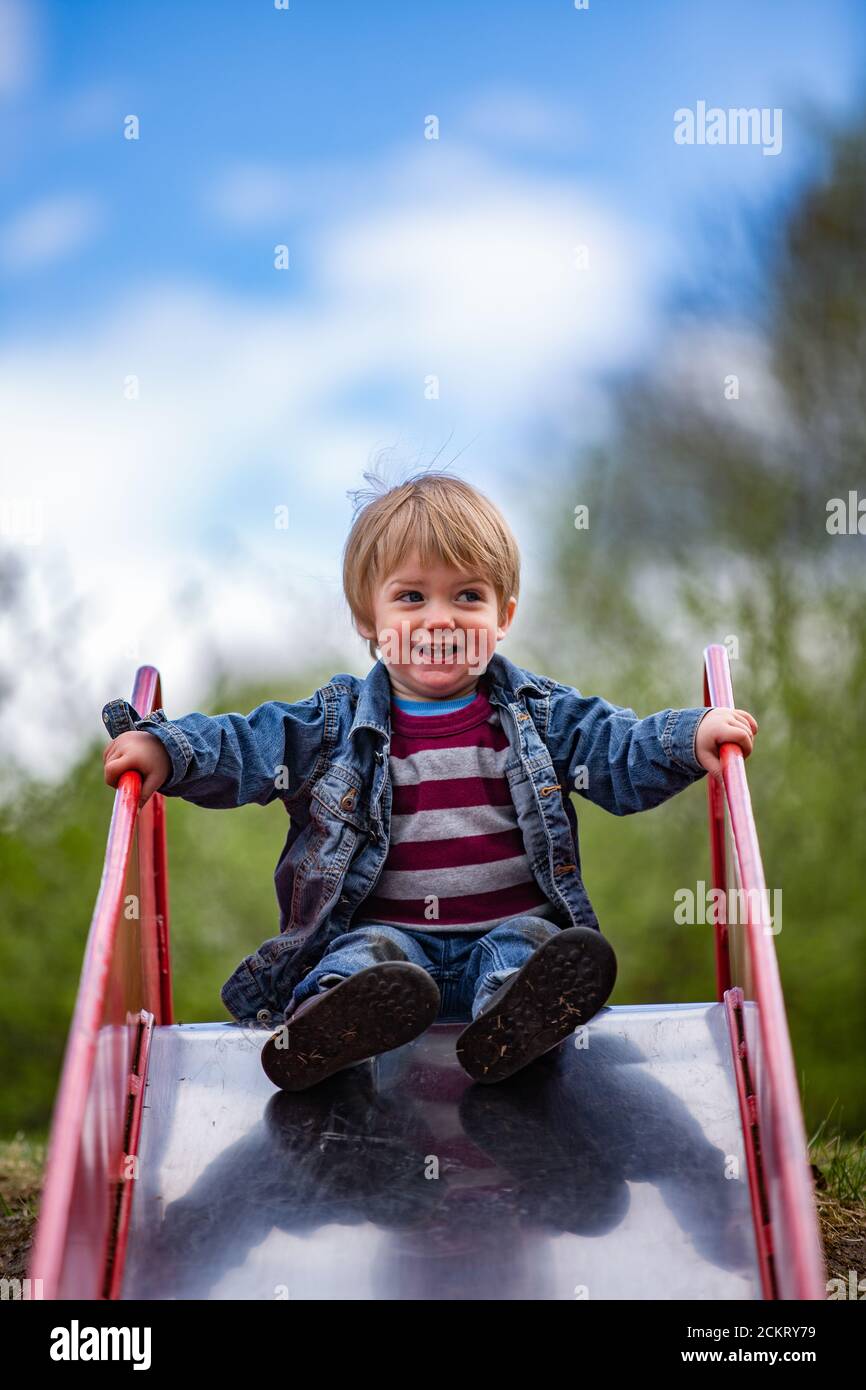 Boy on a slide hi-res stock photography and images - Alamy