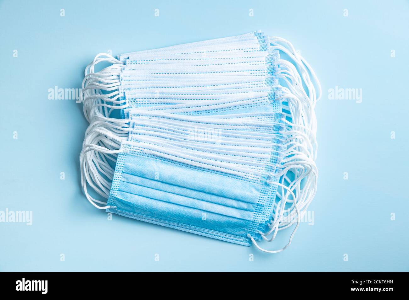 Blue paper face masks. Corona virus protection on blue background Stock ...