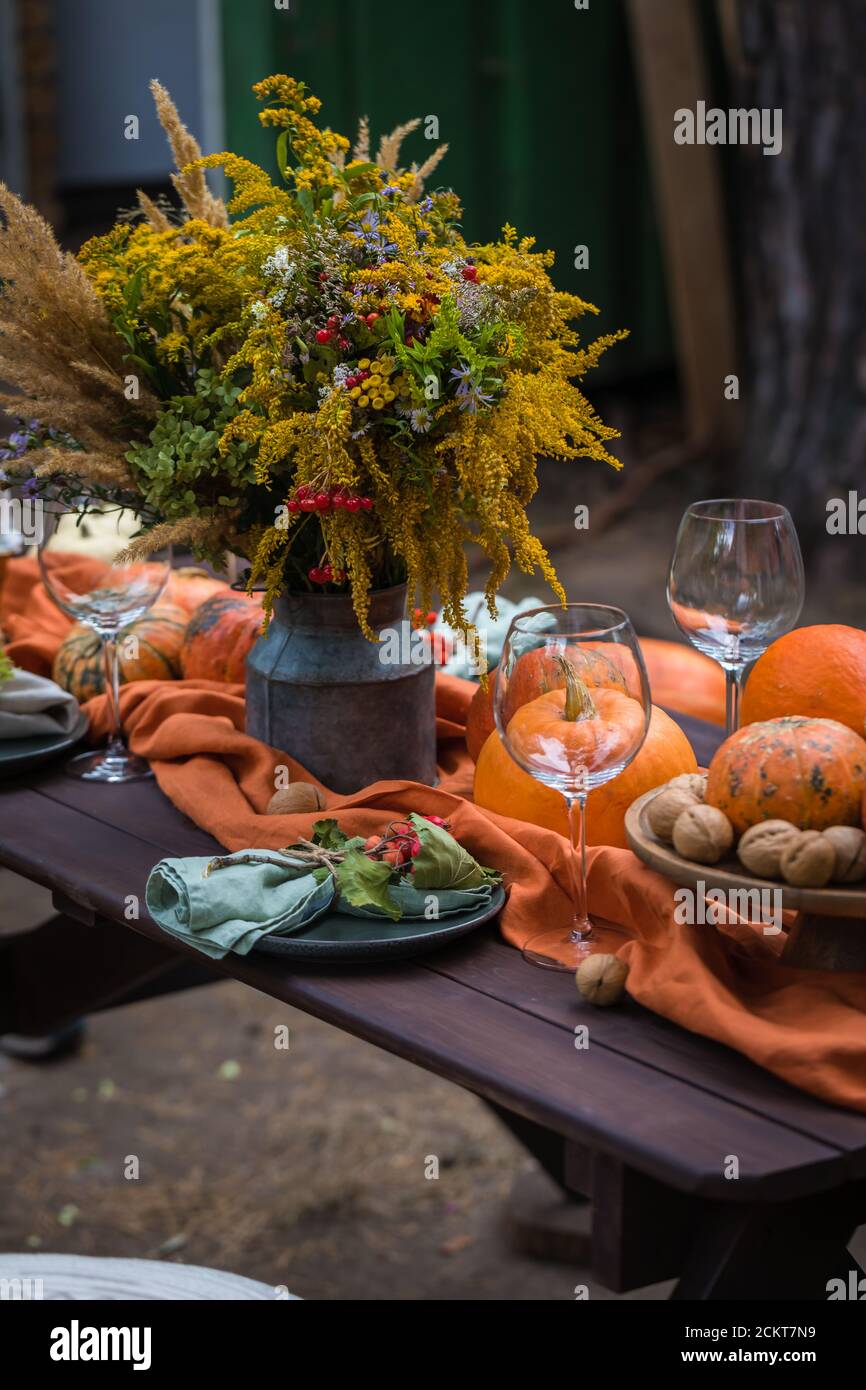 Fall themed holiday table setting arrangement for a seasonal party ...