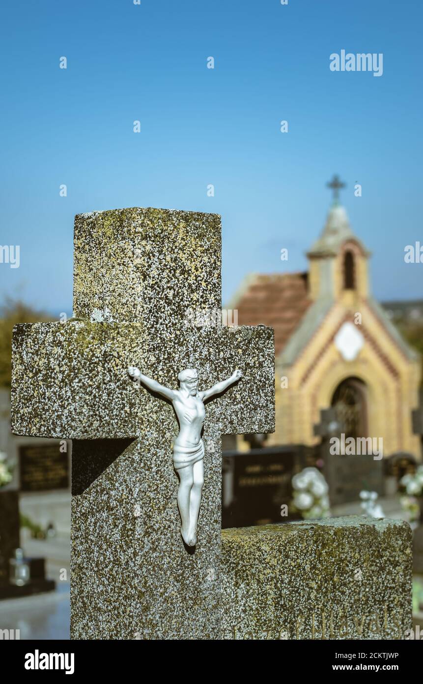 religious atmosphere in the cemetery with cross symbol and church in ...