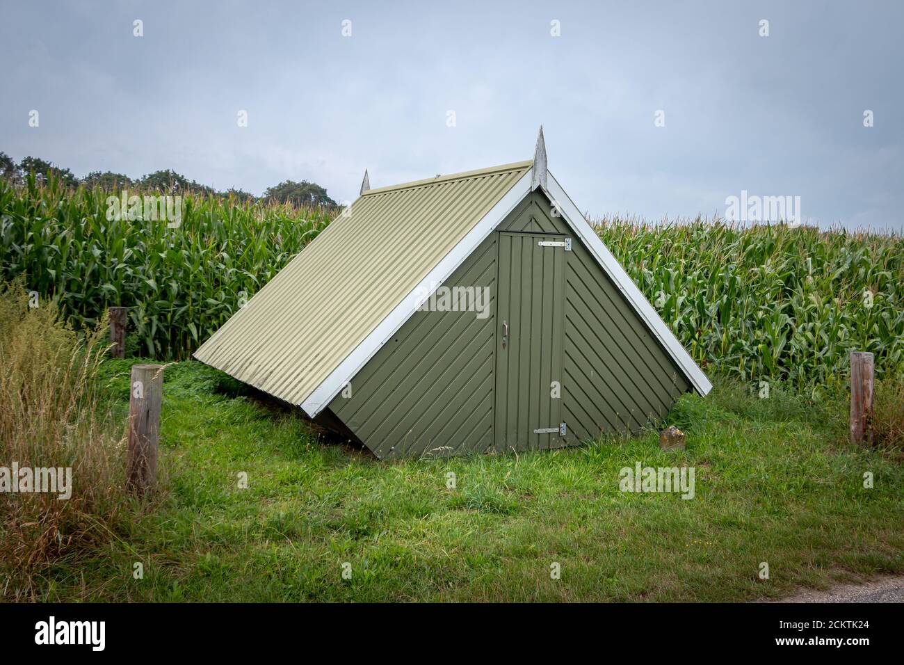 small green salt houses in the Dutch Twente landscape with pipes and ...