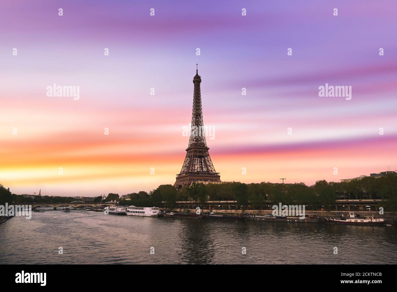 Sunset over the the Eiffel Tower and the Seine River in Paris, France ...