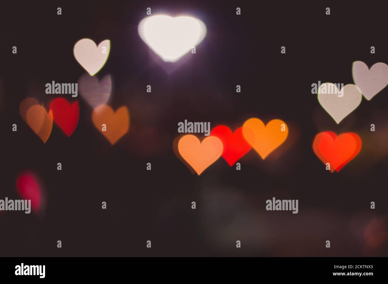 heart-symbol-with-copy-space-shining-on-black-background-stock-photo