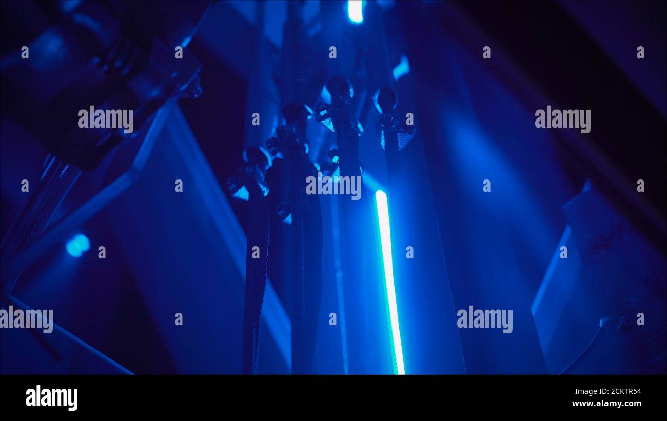 Lifts in modern interior in blue. Glass elevator Stock Photo - Alamy