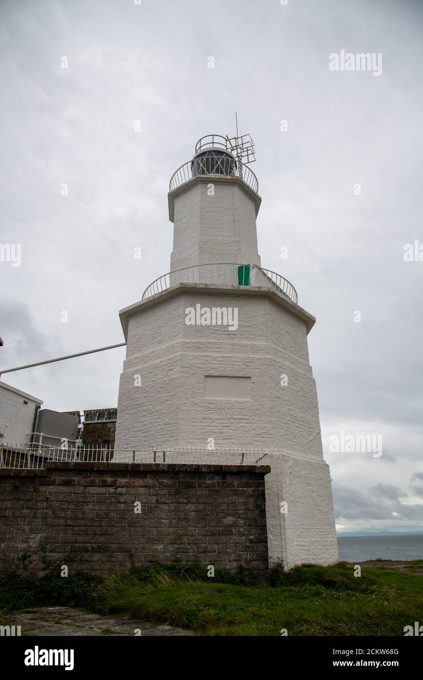 Offshore island with lighthouse on Mumbles Head in Swansea Bay Stock ...