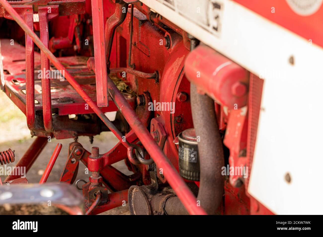 Old red tractor engine of a Same tractor Stock Photo - Alamy