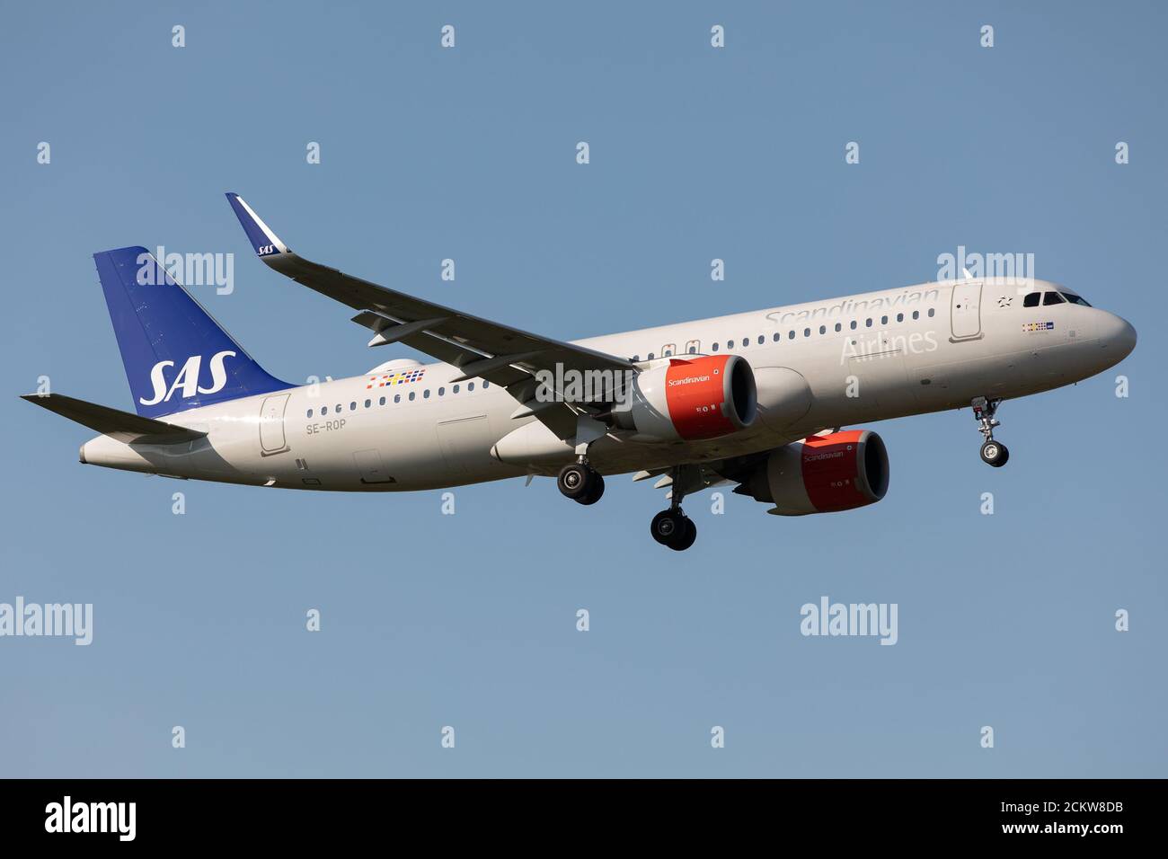 A SAS Scandinavia Airbus A320 lands at London Heathrow Airport, England ...