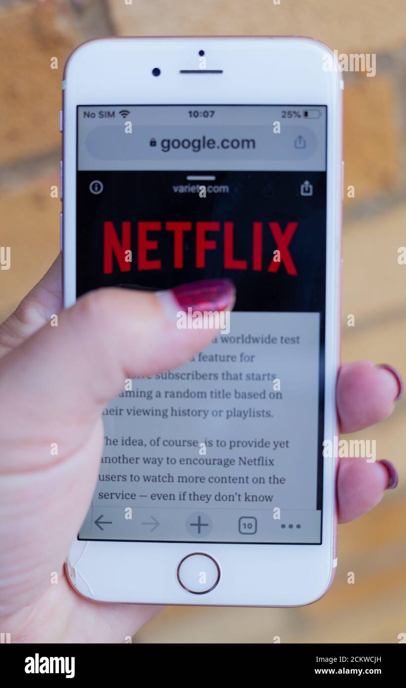 Tech lifestyle - close view of a female hand holding mobile phone ...