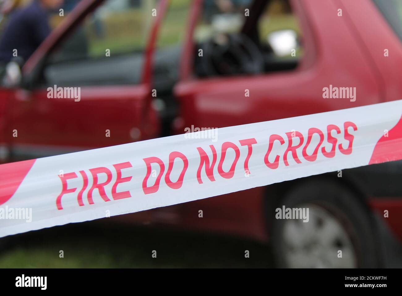 A Fire Service Warning Tape at a Crashed Car Site Stock Photo - Alamy