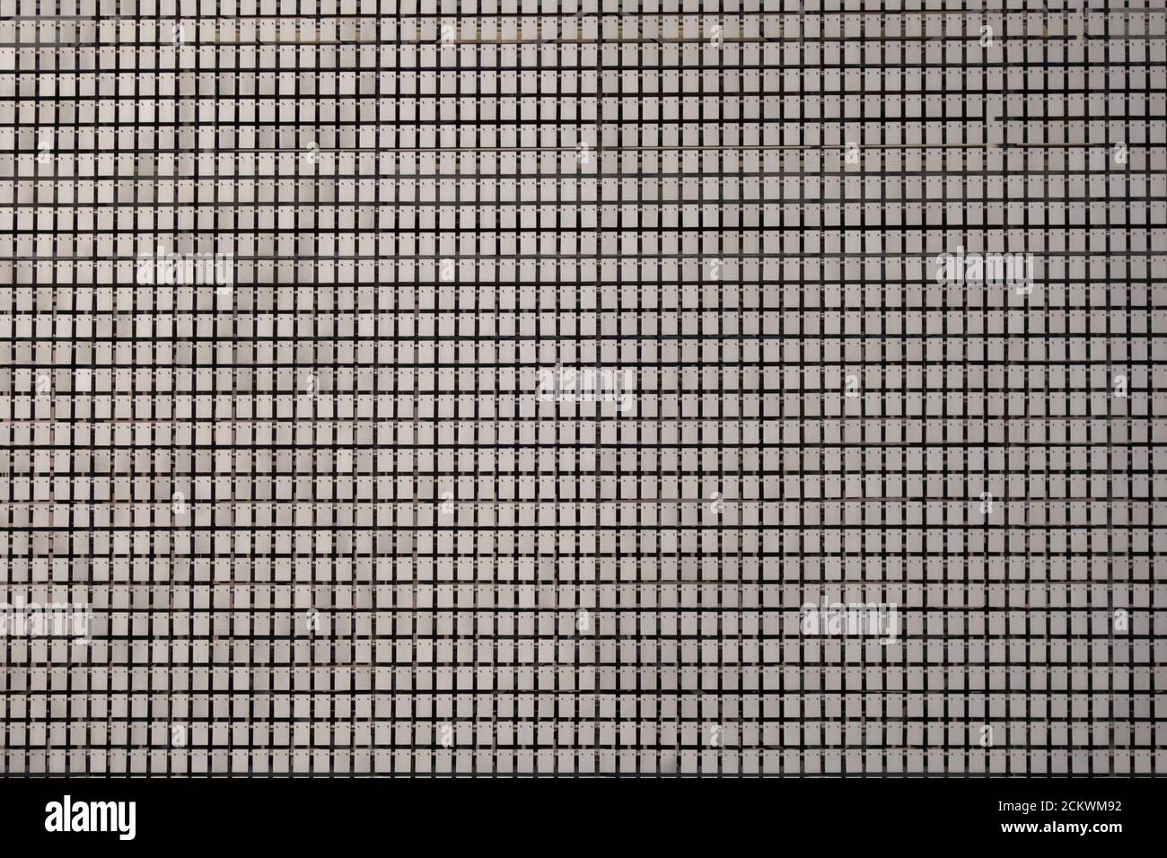 The kinetic facade of the building. Loose metal plates swing in waves ...