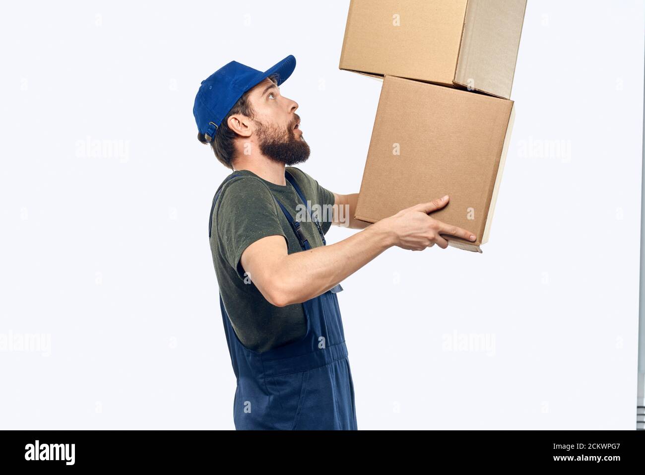 Working man with boxes in hands delivery service work lifestyle Stock ...