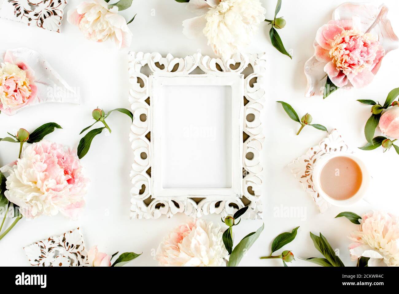 Carved, white frame decorated of beautiful pink peonies on white ...