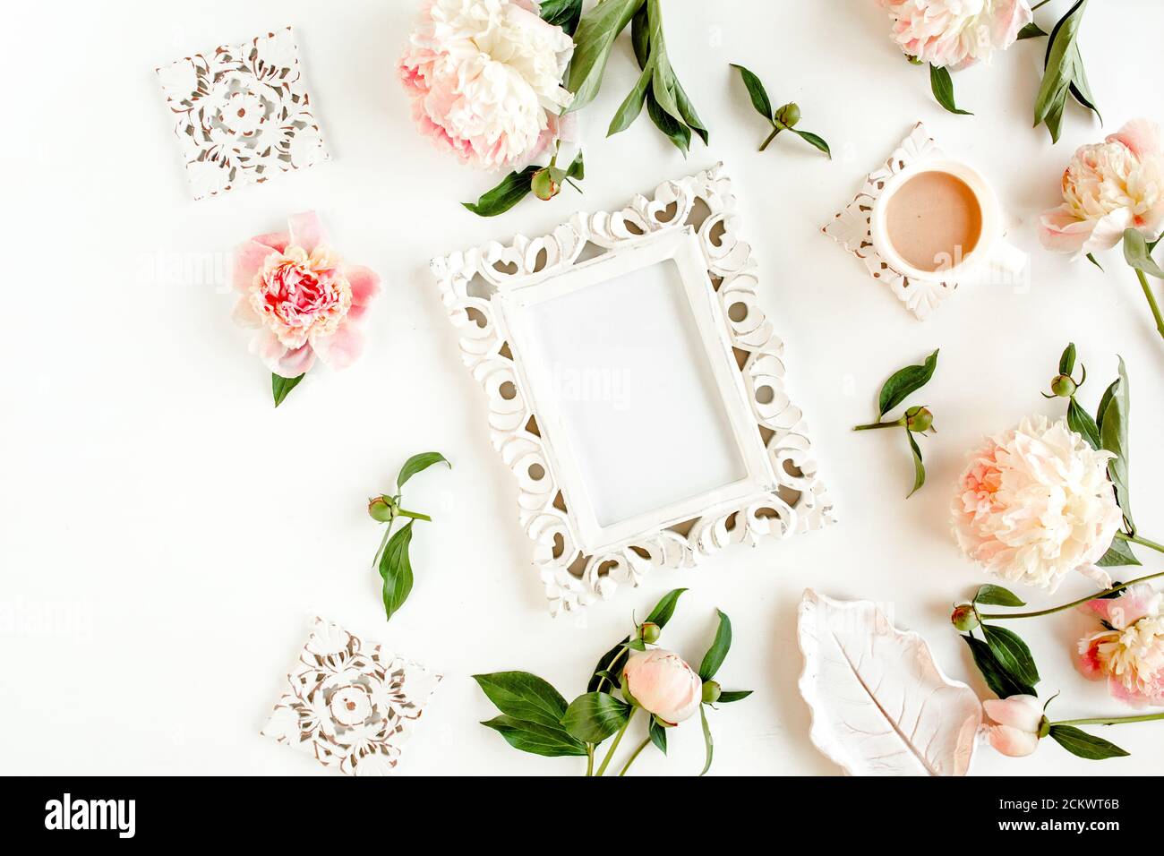 Carved, white frame decorated of beautiful pink peonies on white ...