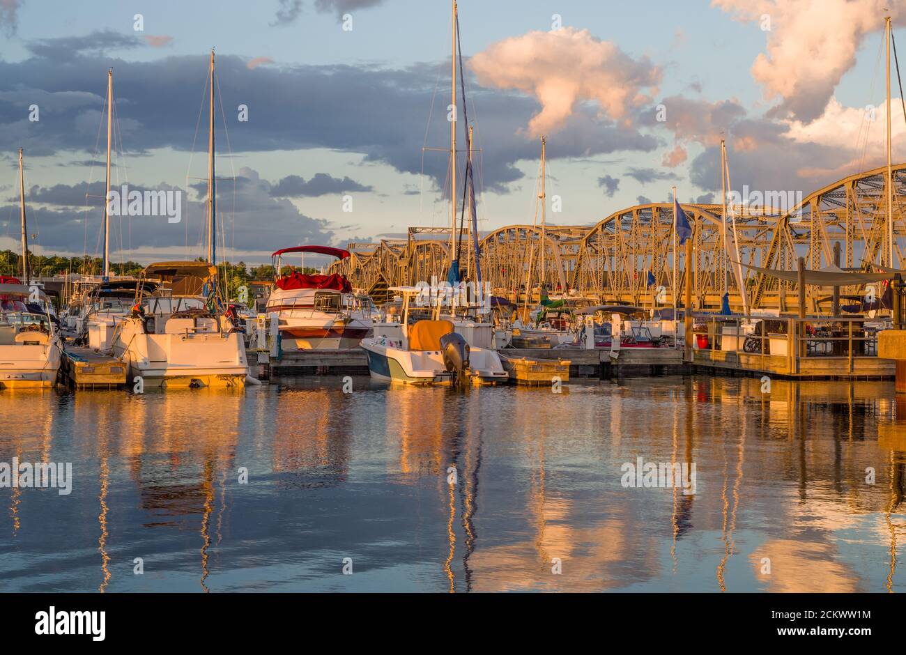 Wisconsin Port on a Summer Evening: Sunset colors decorate the water ...