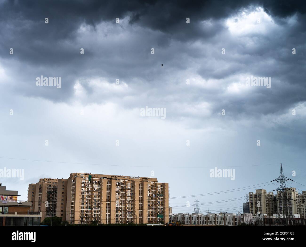 gurgaon delhi cityscape with monsoon clouds casting shadows on high ...