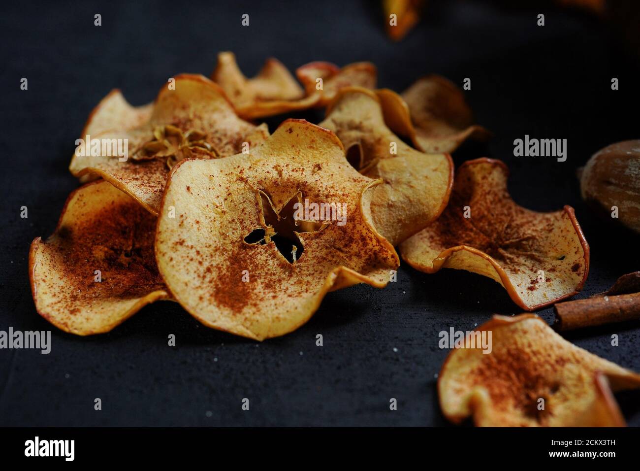 Homemade Baked Apple chips on fall autumn background Stock Photo - Alamy