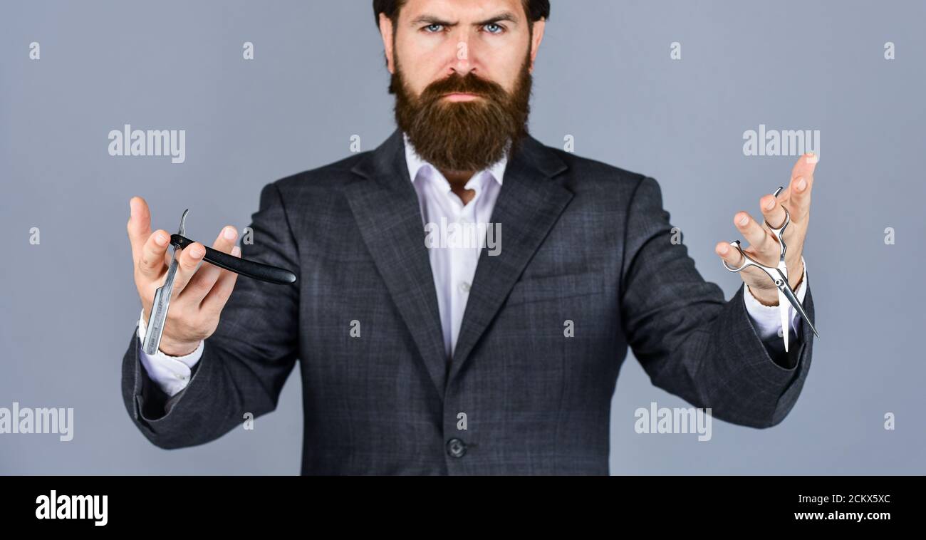 handsome male. Master grooming hair and beard in barbershop ...