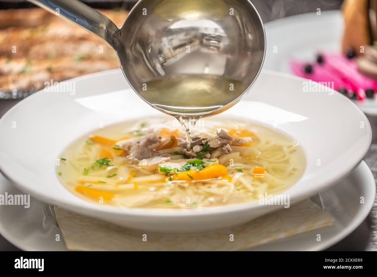 Clear soup poured bowl top hi-res stock photography and images - Alamy