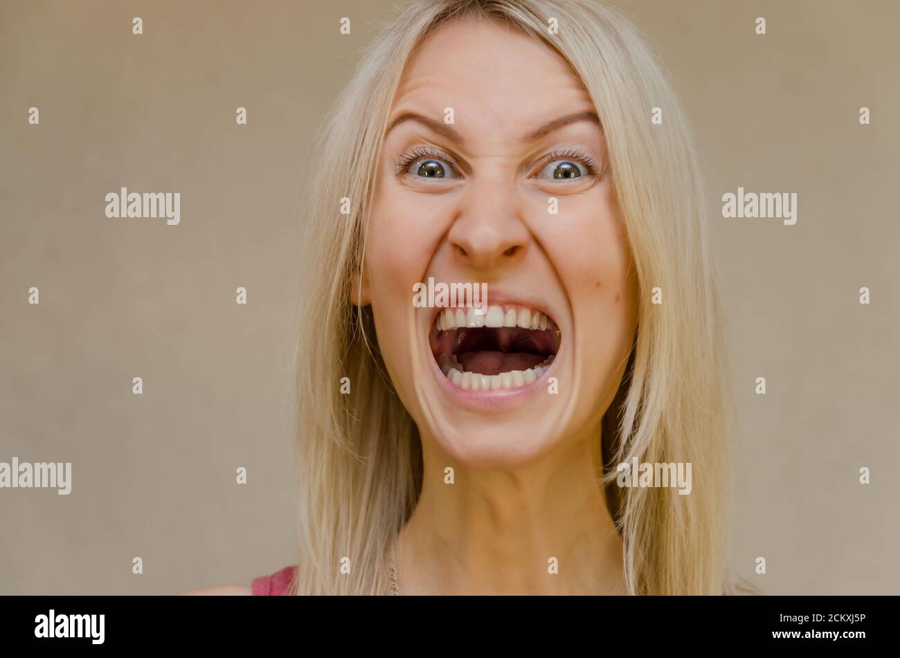Portrait of a girl who screams, angry. Manifestation of emotions by a ...
