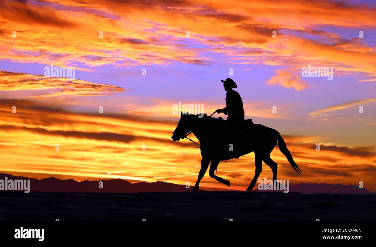 Cowboy on a horse silhouetted against the sunset Stock Photo - Alamy