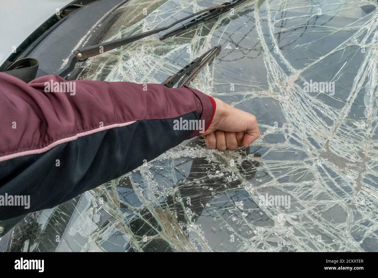 Punch in the windshield of the car. Cracks on the windshield of a car ...