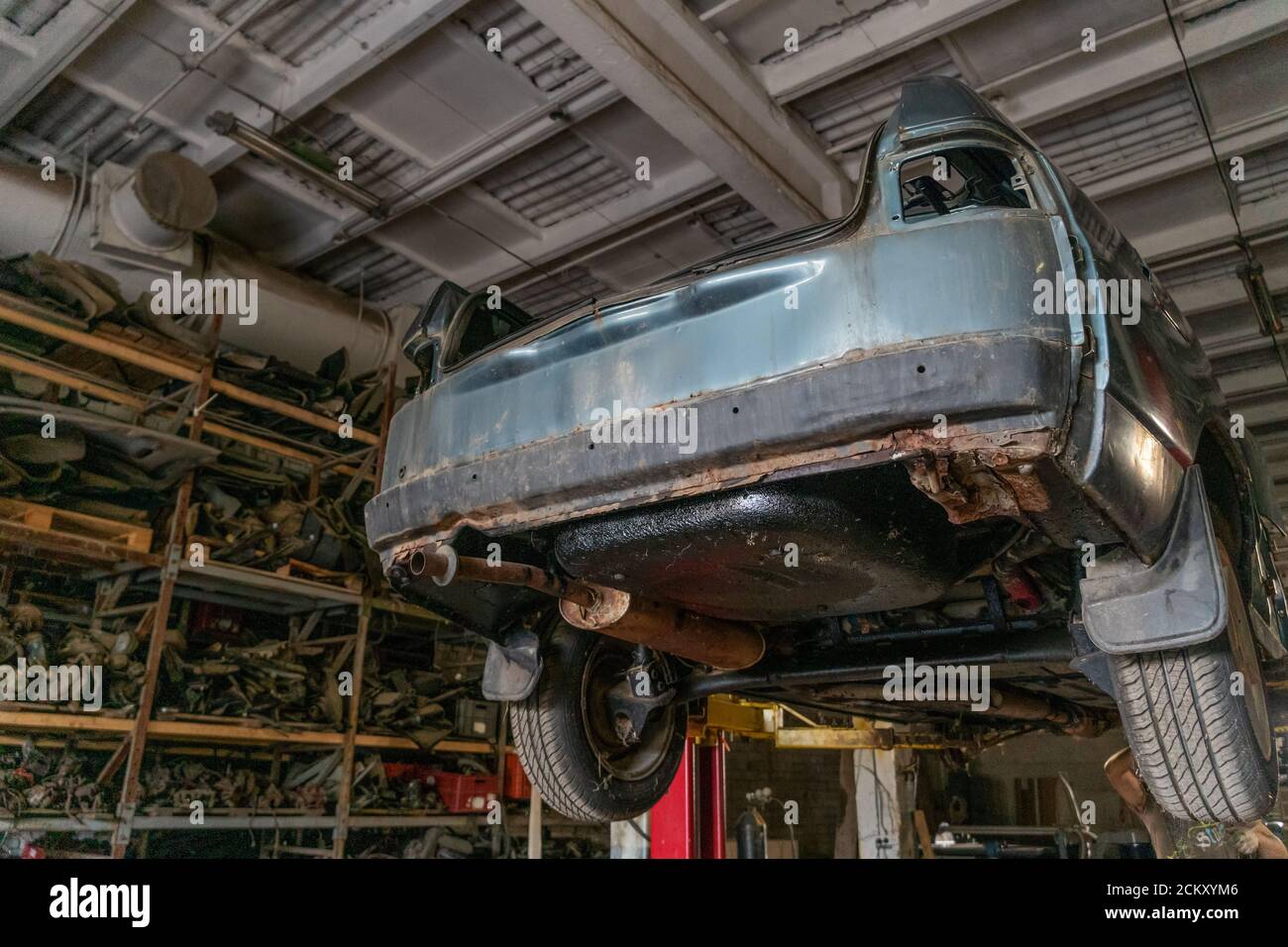 Car body on the lift, disassembly Stock Photo - Alamy
