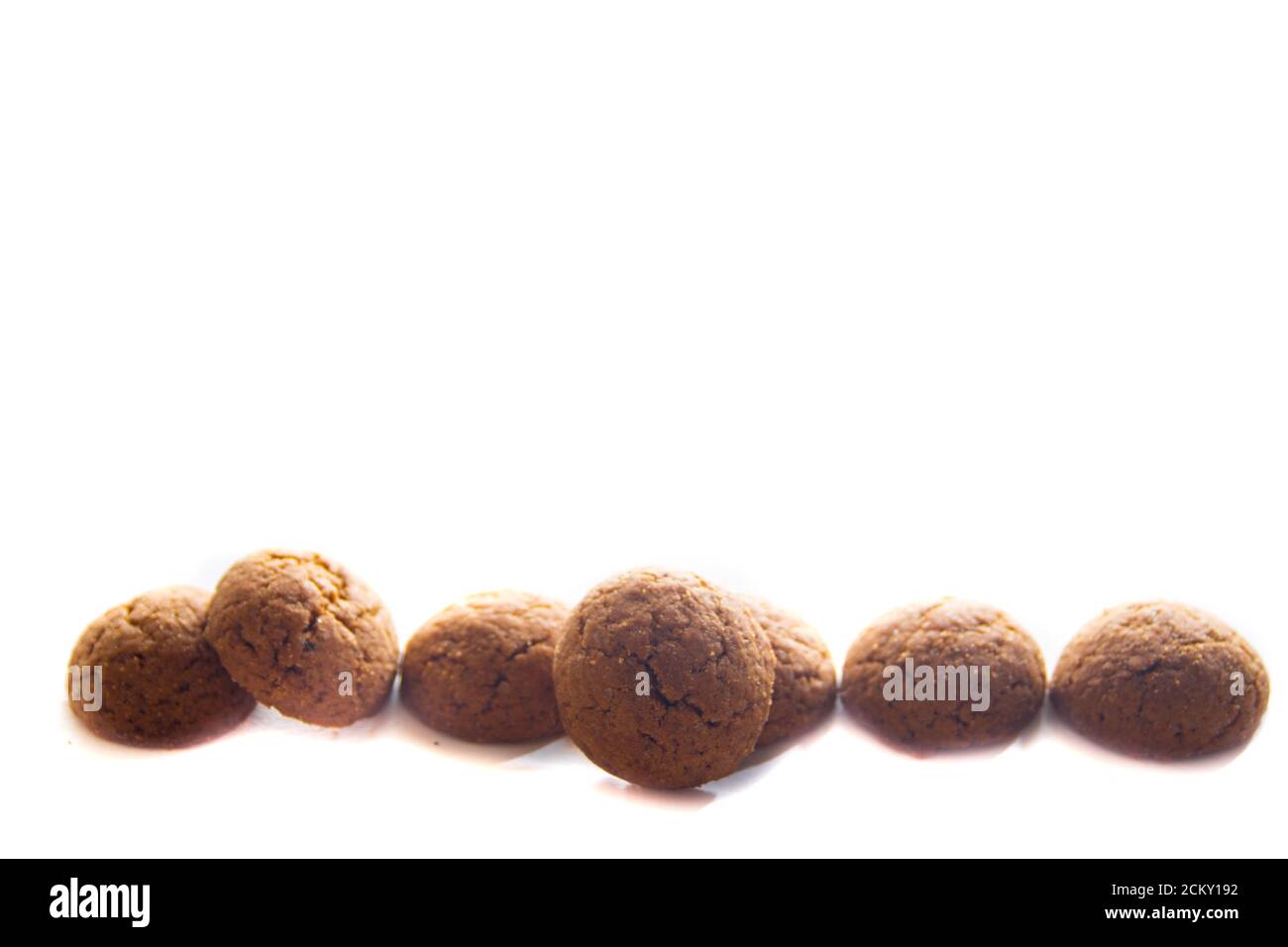 Side view of traditional Dutch Candy called 'Pepernoten' on white ...