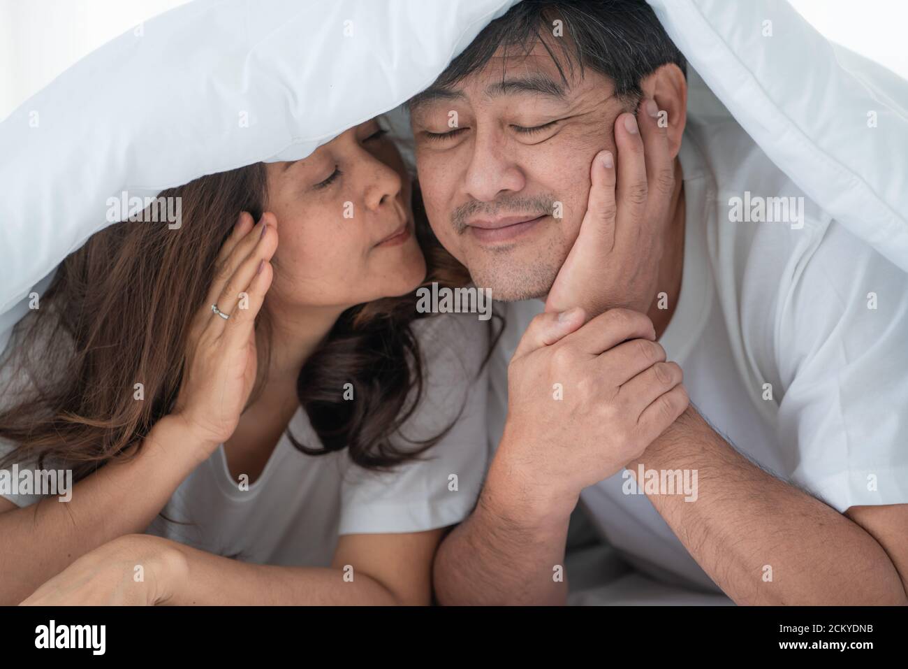 Happy Asian Senior Couple Having Good Time At Home Old People