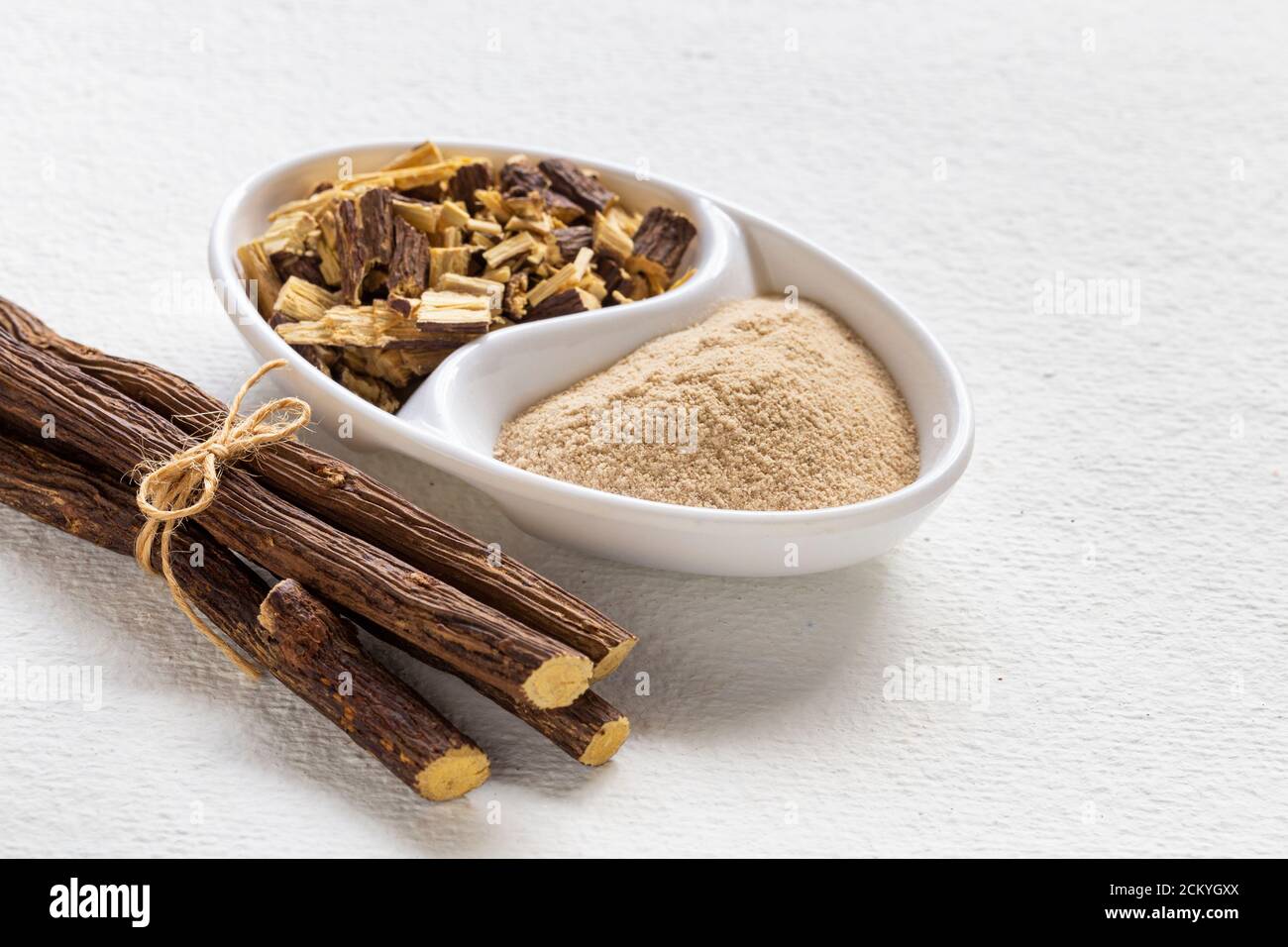 Licorice medicinal plant root, on white background - Glycyrrhiza glabra ...