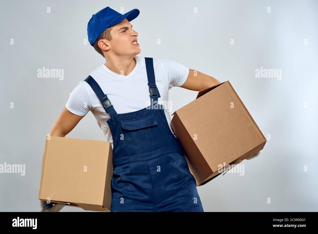 Man worker with box in hands delivery loading service packing service ...