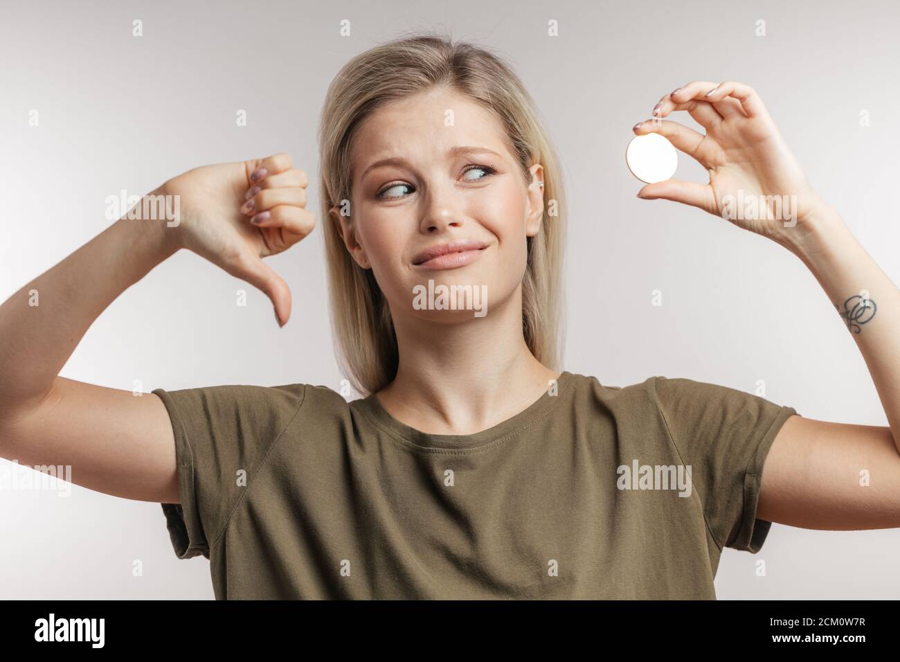 Human emotions and gestures concept. Attractive young woman with blonde ...