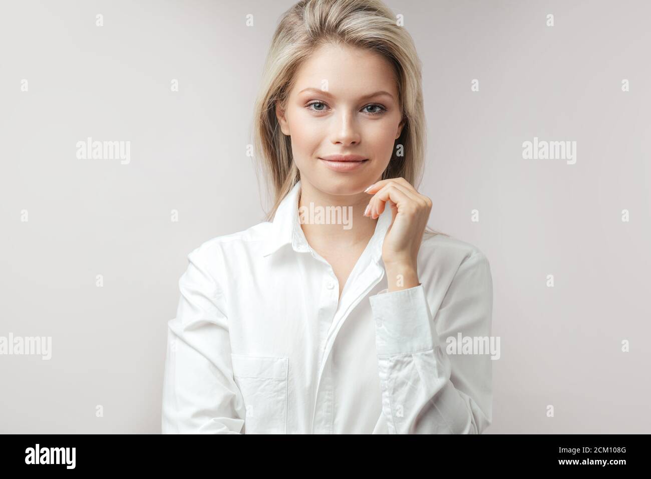 Portrait of a young female sales manager with gorgeous blonde hair ...